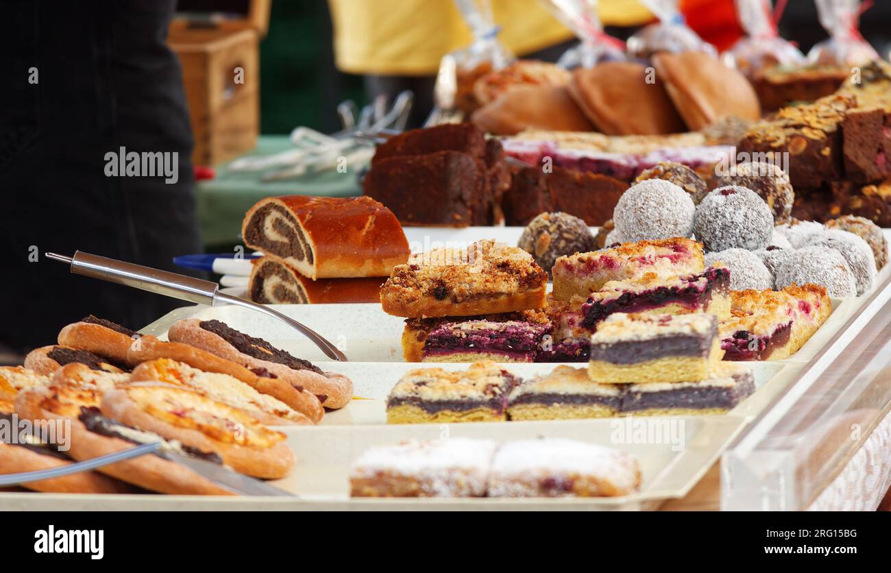 Bakery stand with variations of pastries, brownies, pies, cakes, and ...