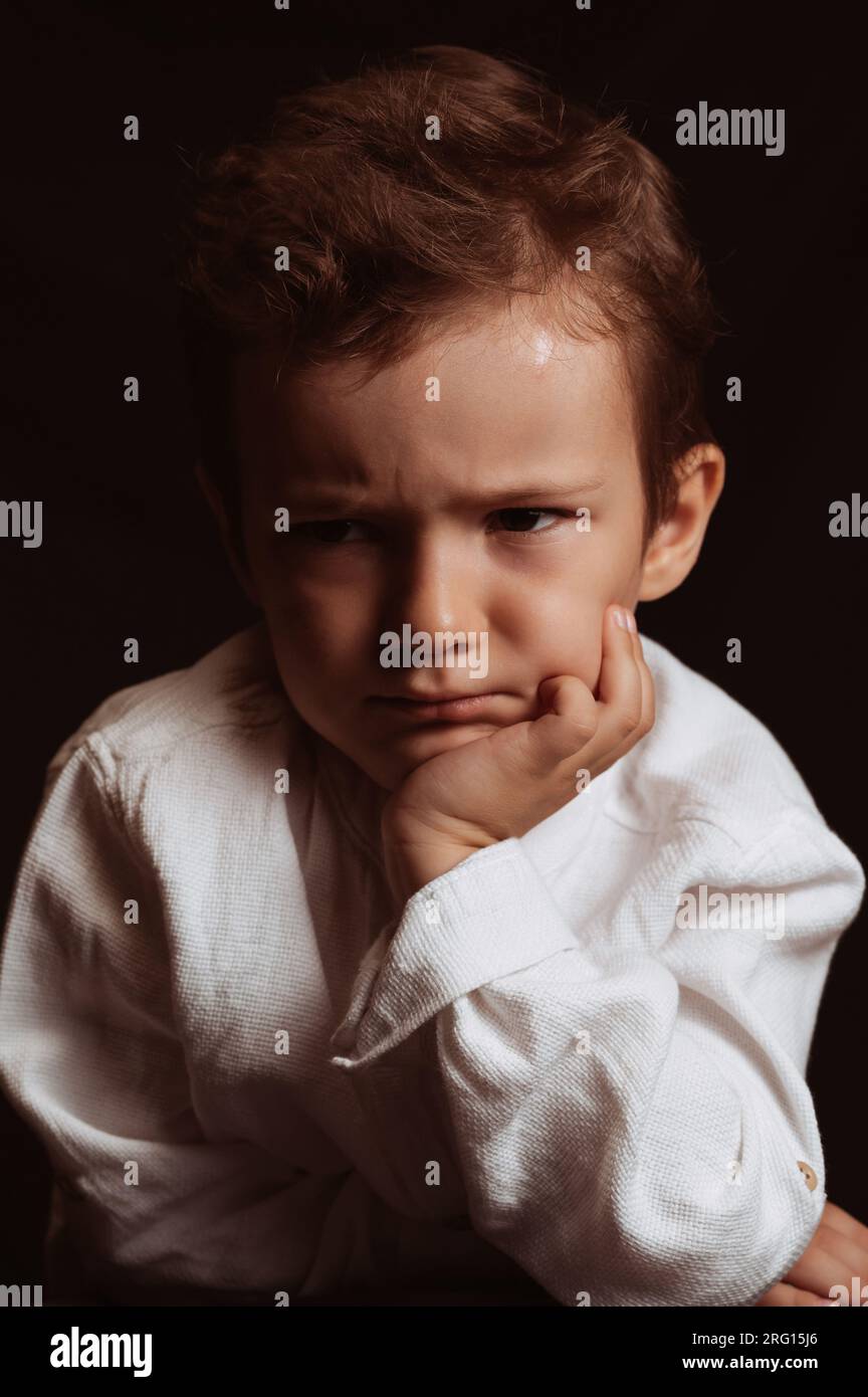 portrait of a sad angry child a preschooler boy Stock Photo - Alamy