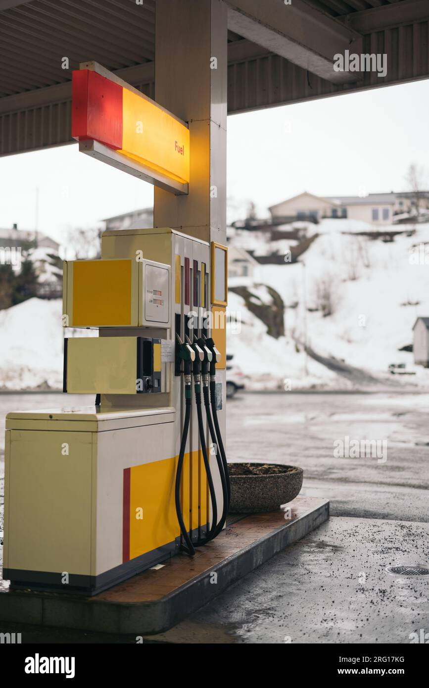 Side view modern colorful petroleum fuel dispensing station with set of ...