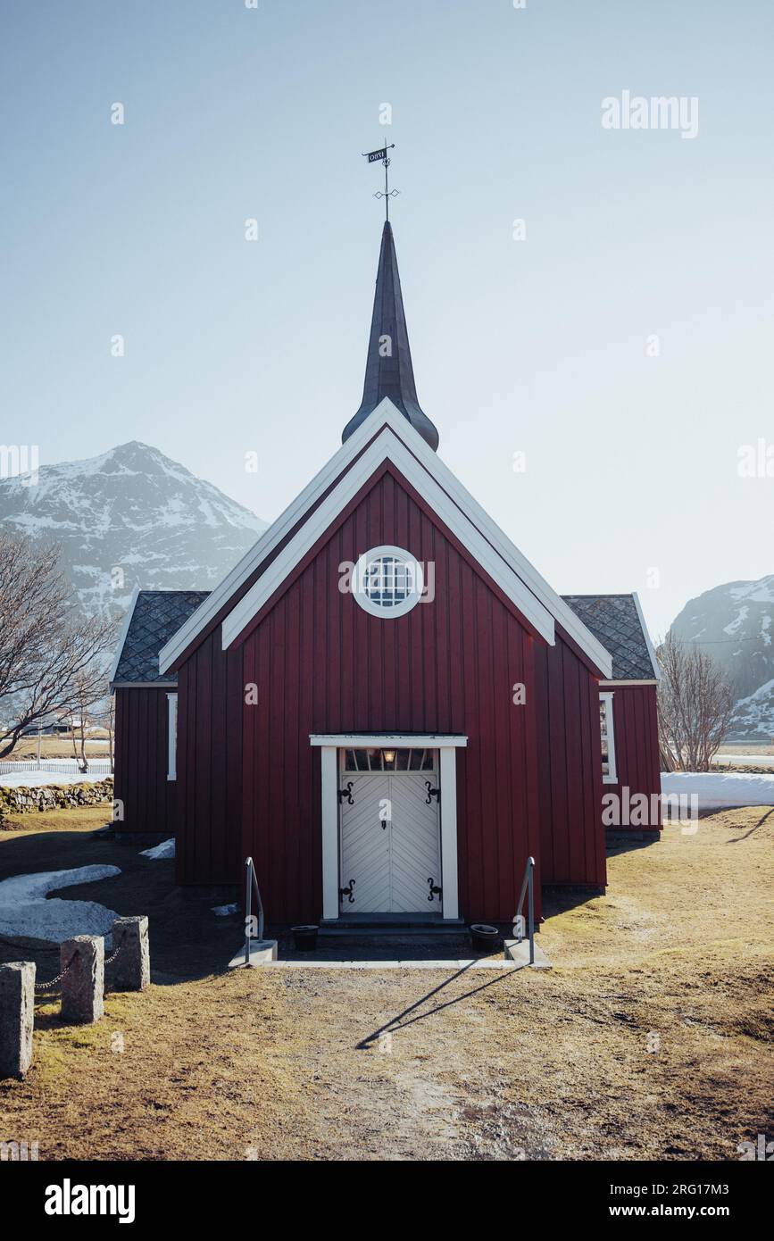 Exterior of old red long church building with wooden roof and ...