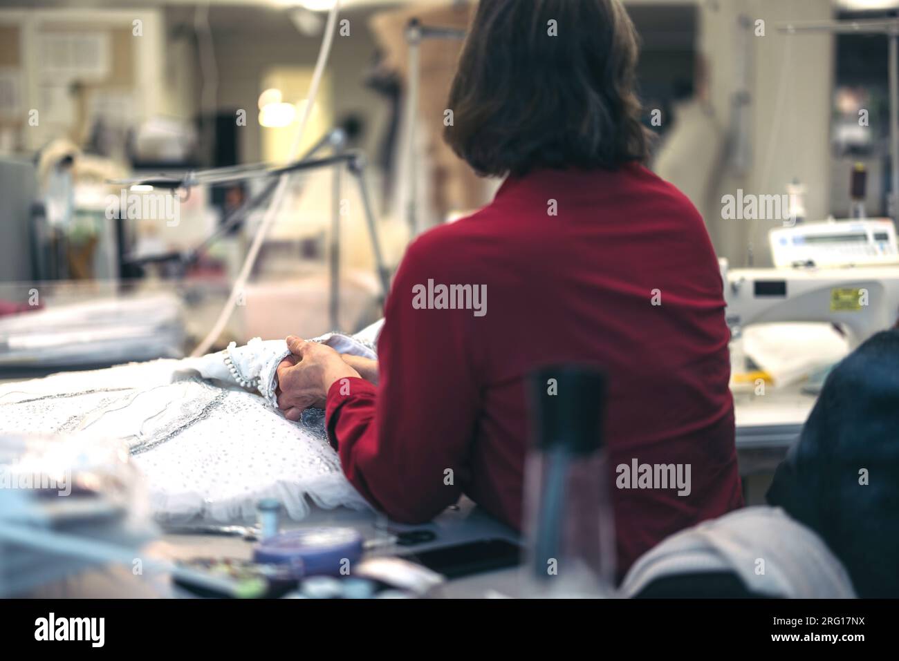 Garments seated hi-res stock photography and images - Alamy