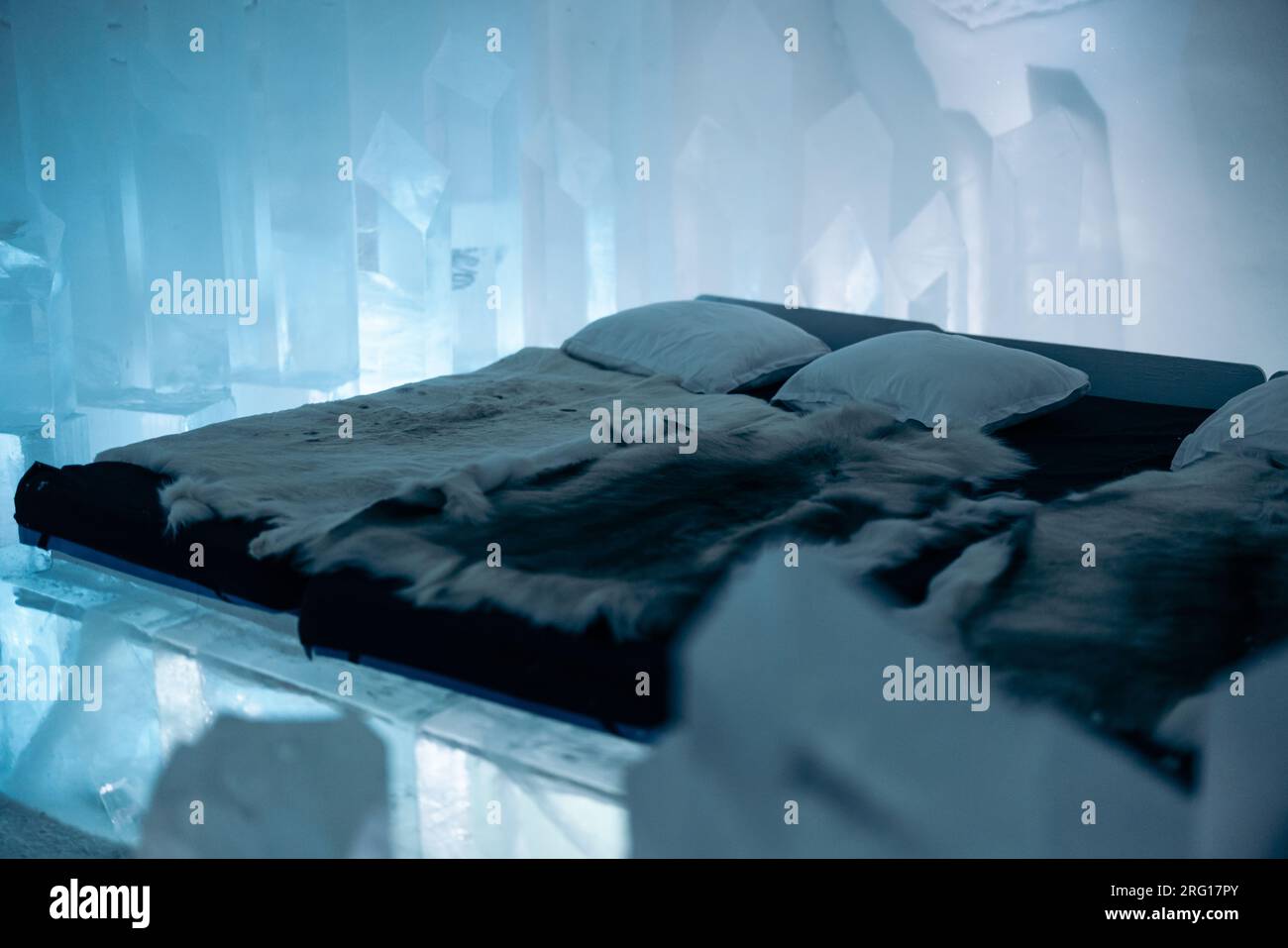 Bedroom with ice bed covered with reindeer skin bedspread in hotel ...