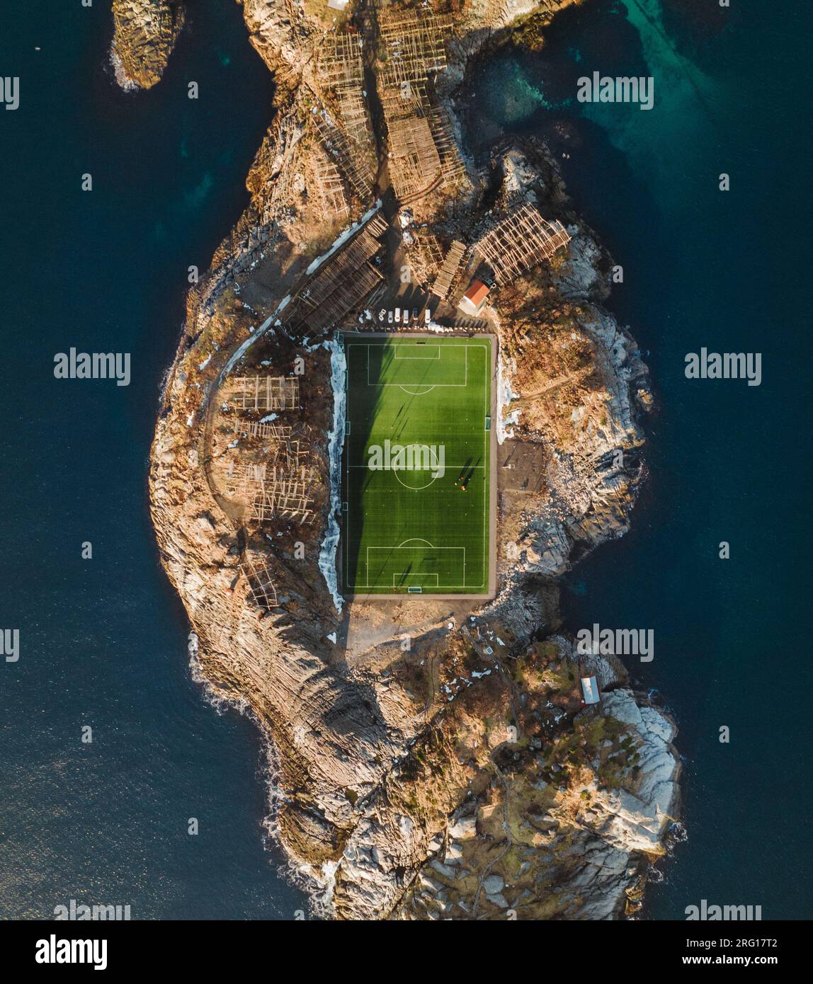 Aerial view of Henningsvaer archipelago island with lush green football ...