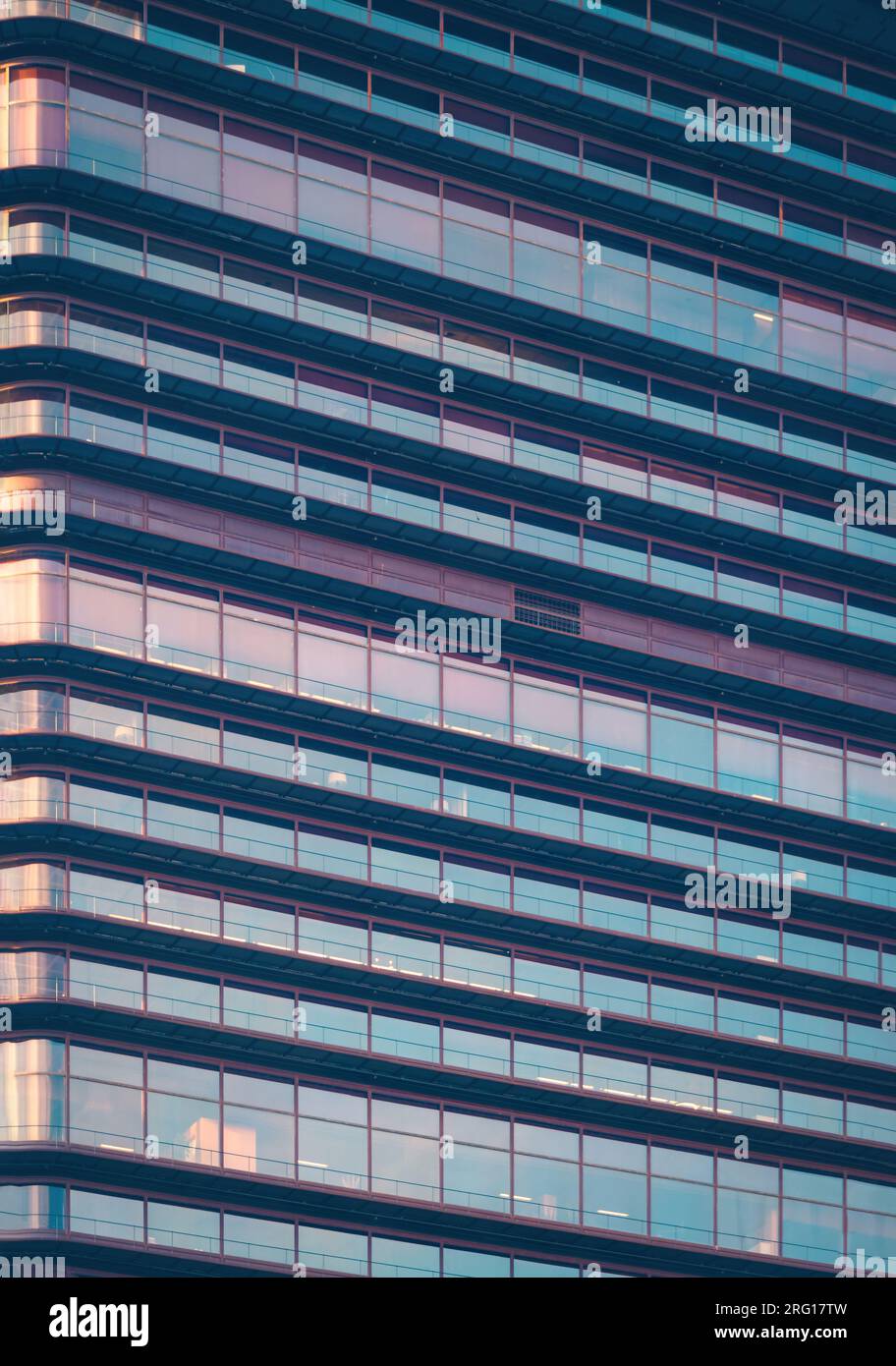 Modern tall building with reflective glass walls Stock Photo - Alamy