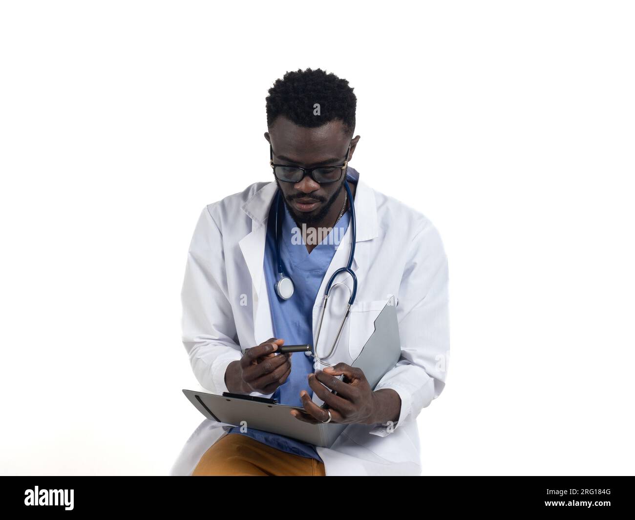 Concentrated young African American male doctor in medical uniform ...