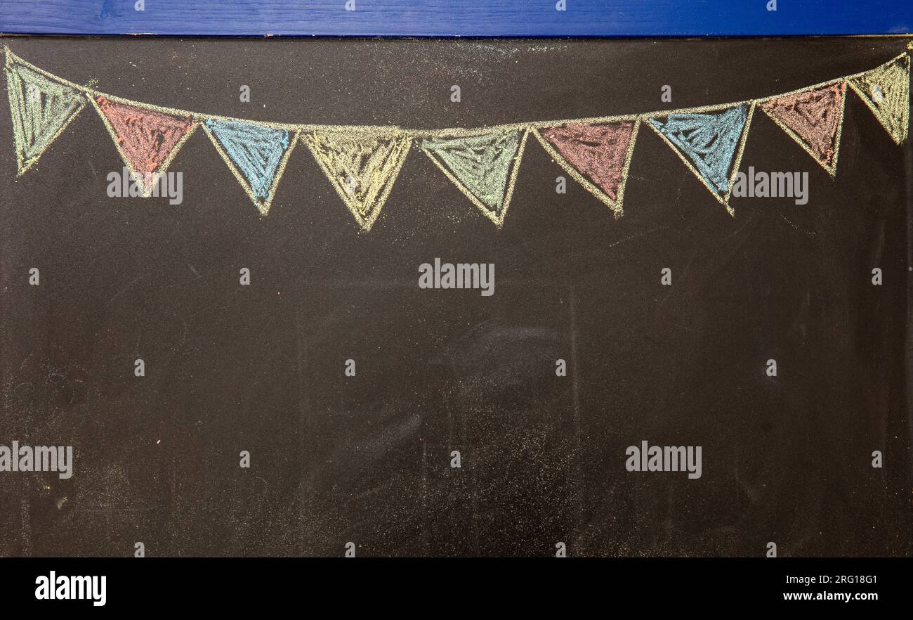 Colorful pennants on a chalkboard Stock Photo - Alamy