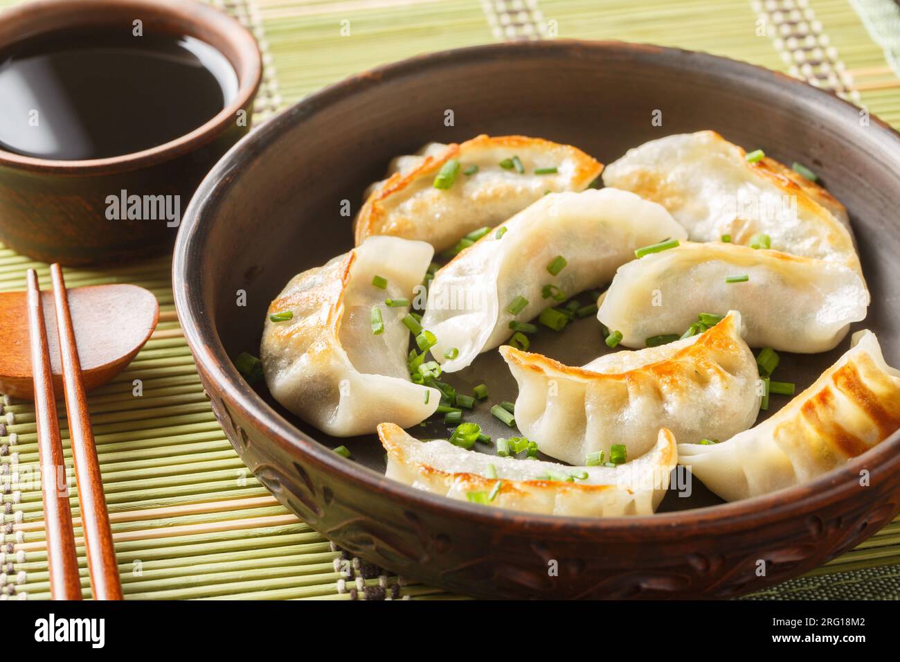 Golden gyoza served on plate hi-res stock photography and images - Alamy