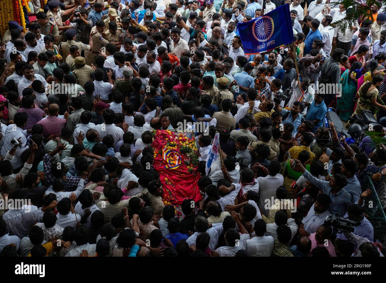 People gather during the funeral of revolutionary poet Gummadi Vittal ...