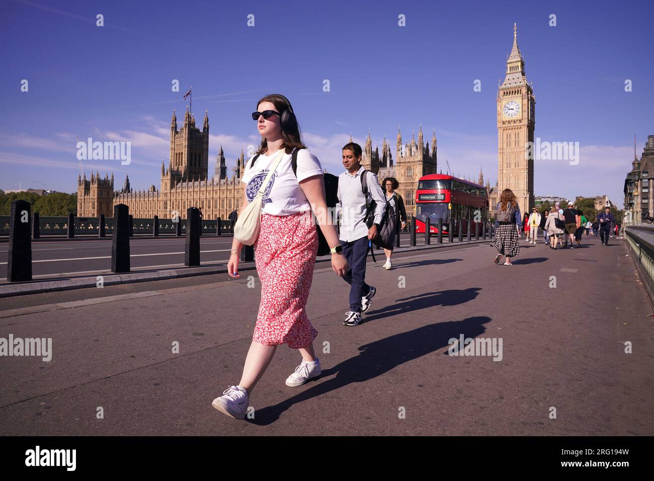 People cross Westminster Bridge in London. Picture date: Monday August ...