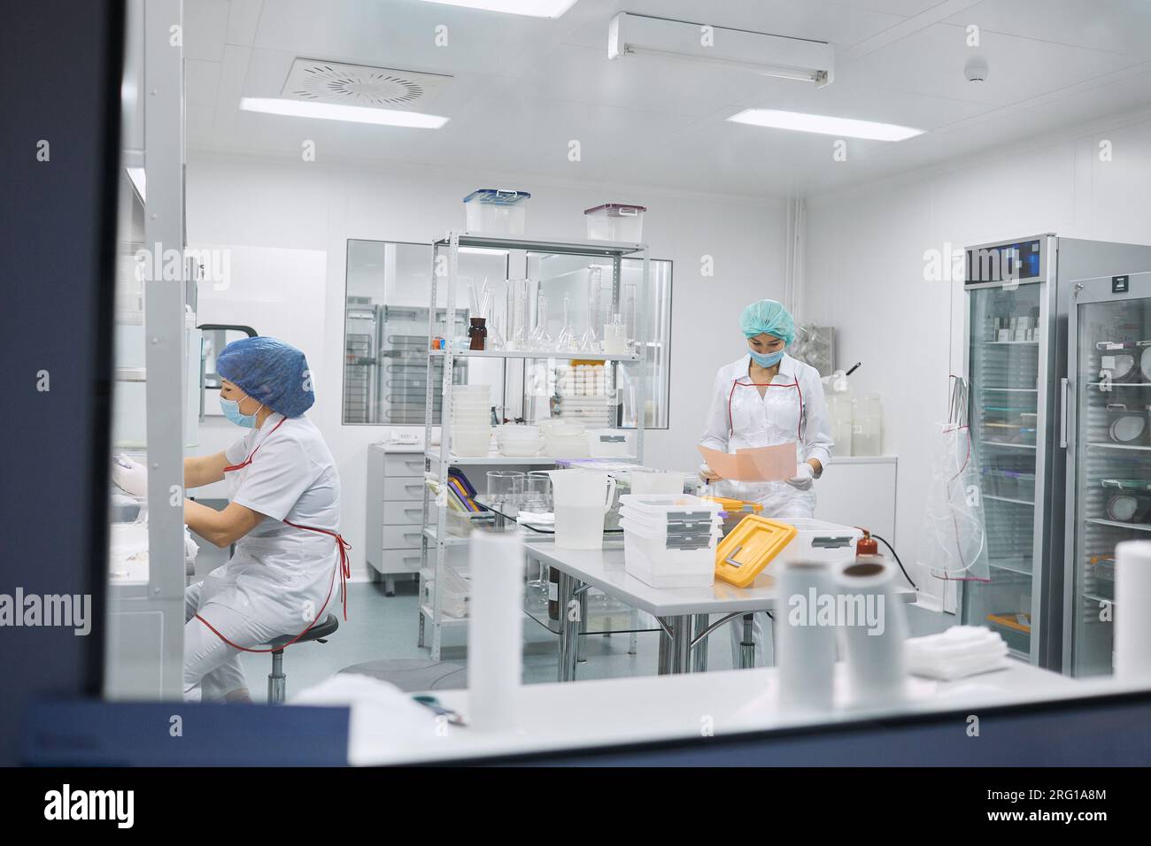 Female scientist conducts experiments in hi-res stock photography and ...