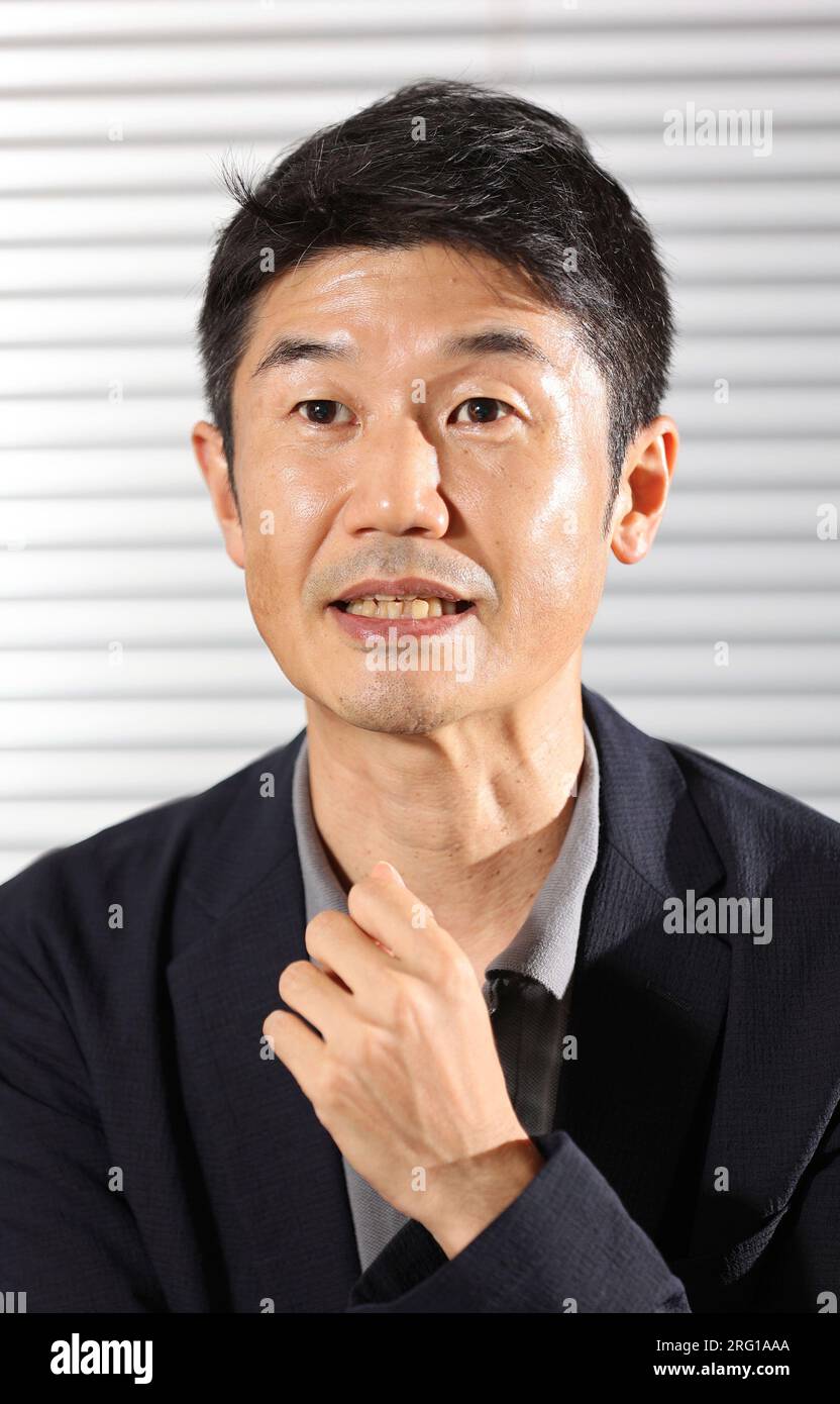 Motoaki Tanigo, President and CEO of COVER, attends an interview in ...