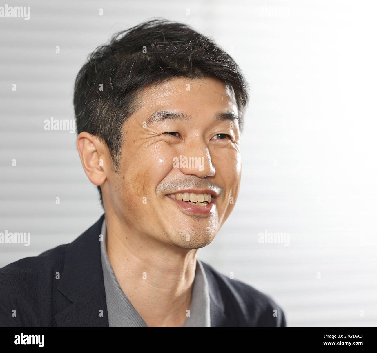 Motoaki Tanigo, President and CEO of COVER, attends an interview in ...