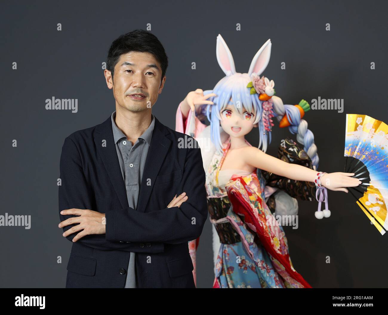 Motoaki Tanigo, President and CEO of COVER, poses for a photo in Tokyo ...