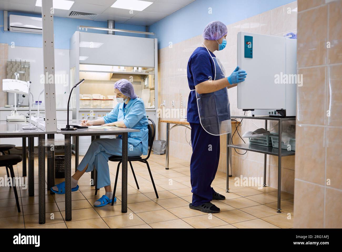 Scientists work in the laboratory. Remove the biomaterial from the ...