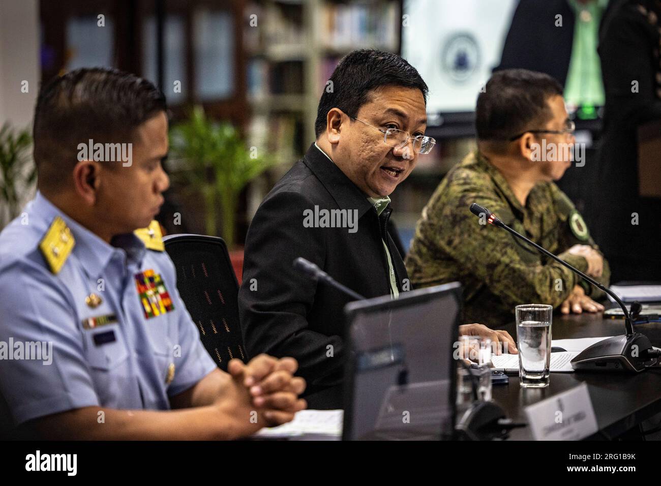 Jonathan Malaya, center, spokesperson for the National Security Council, delivers his speech ...