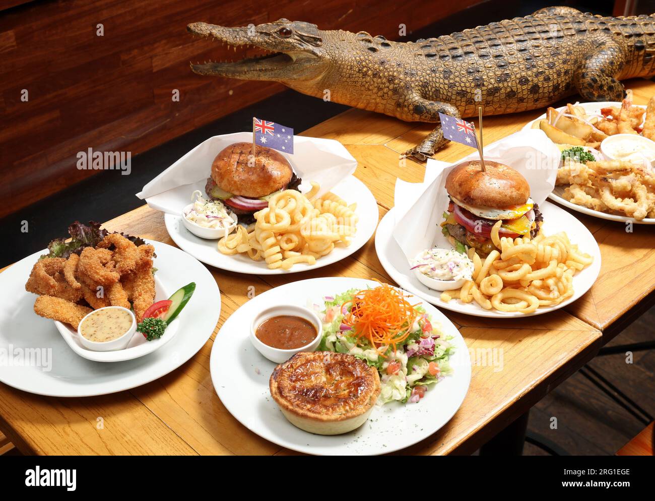 Dishes of meat pie, crocodile nuggets, Kangaroo burger, Aussie fish and ...