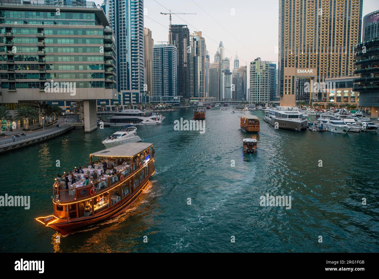 Boats travel through the Dubai Marina in the United Arab Emirates Stock ...