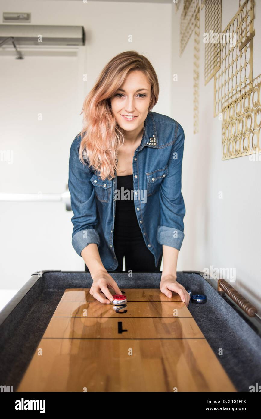 Playing shuffleboard hi-res stock photography and images - Alamy