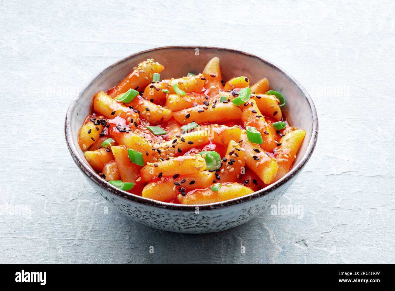 Tteokbokki or topokki, Korean street food, spicy rice cakes in red ...