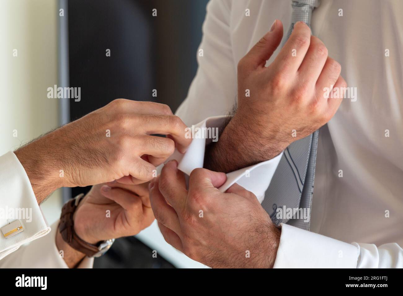 Groom getting dressed and getting ready for his wedding day Stock Photo ...
