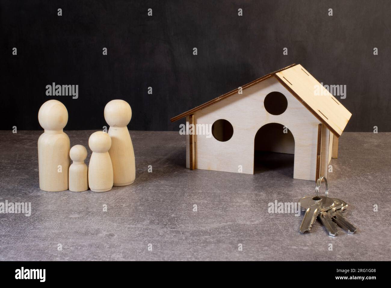 Back view of happy family is standing near their modern house and ...
