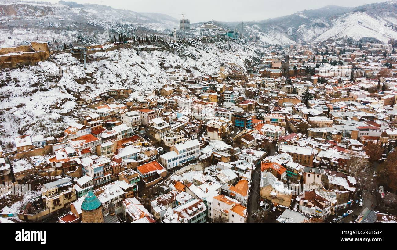 Historical center of old tbilisi covered with snow in winter, aerial ...