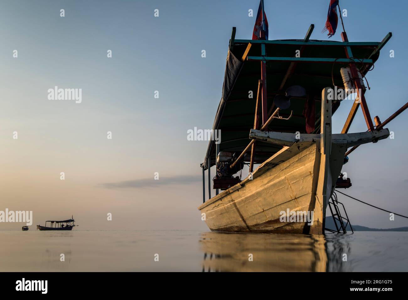 A fishing boat moored at the tranquil waters of the Tui Beach in Koh ...