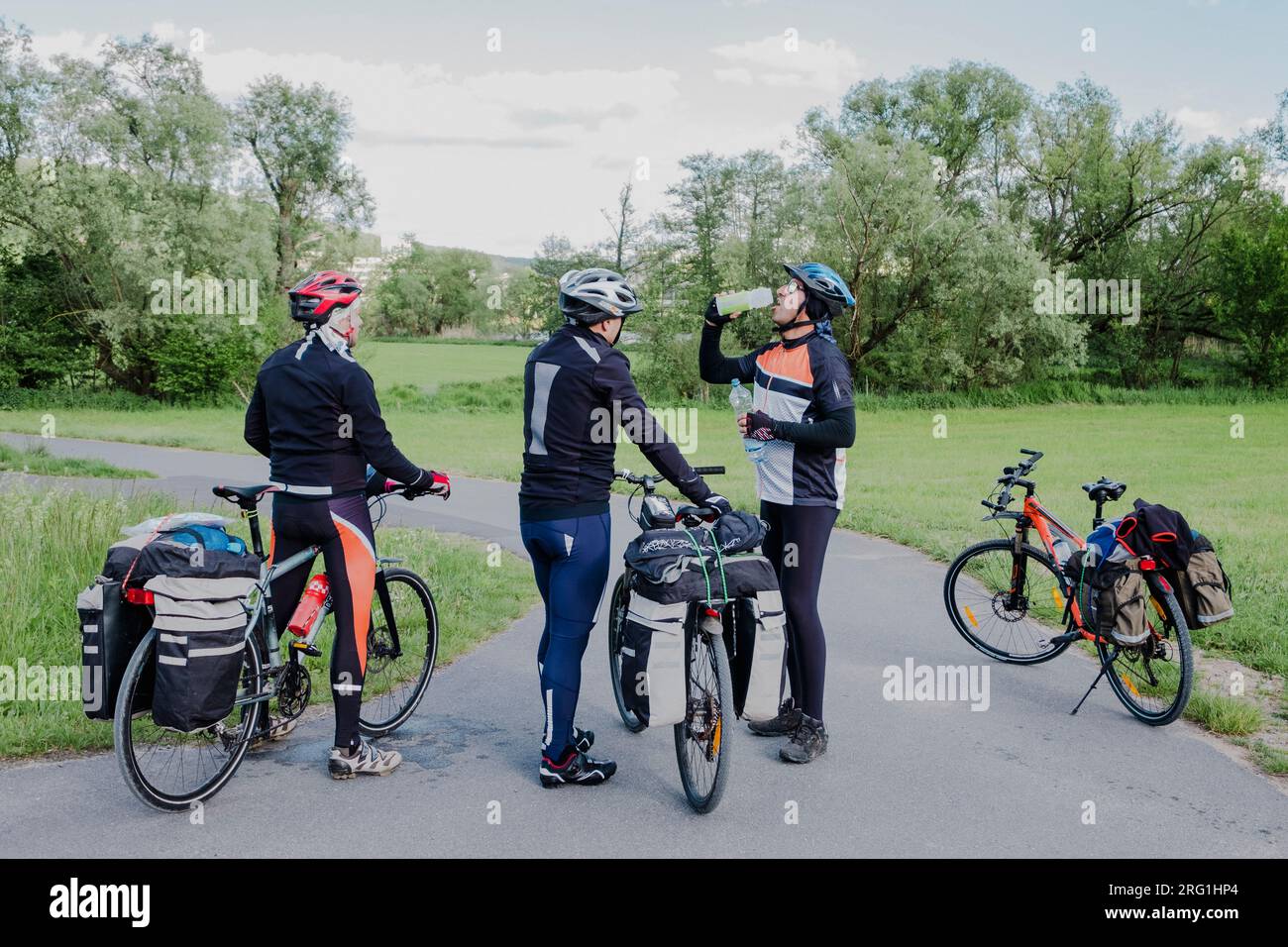 Cyclists rest and drink water in Germany Stock Photo - Alamy