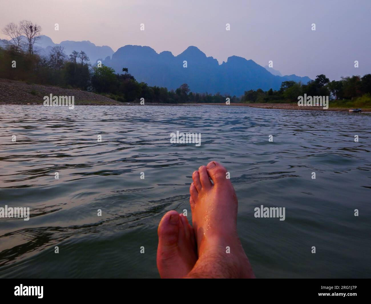 Putting Your Feet Up and Relaxing In a Beautiful River Stock Photo - Alamy