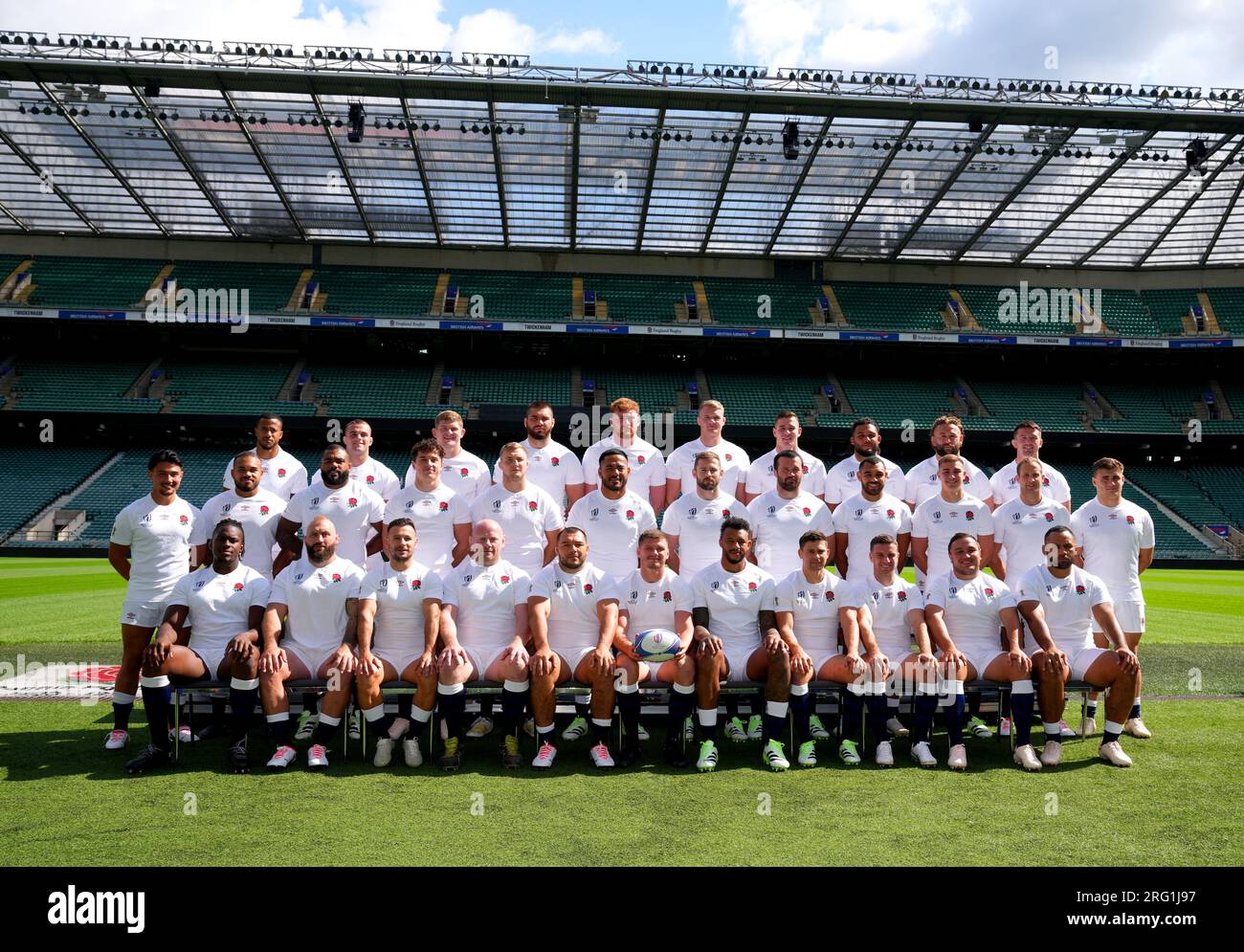 The England team pose for a photo on the pitch during a squad ...