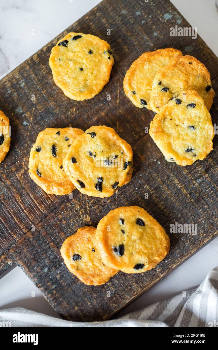 Italian style round shortbread cookies with black olives and Parmesan ...