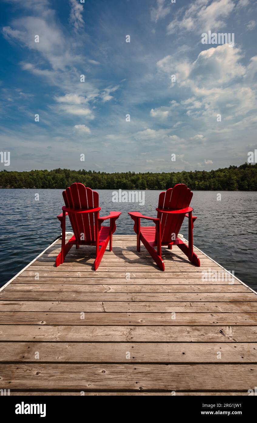Adirondack chair on dock hi-res stock photography and images - Alamy