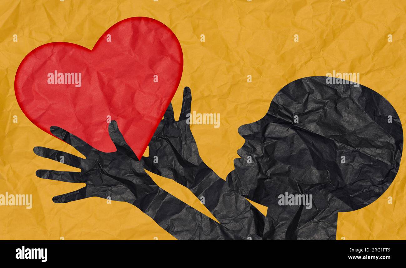 The silhouette of a person cut out of crumpled paper holds a red heart ...