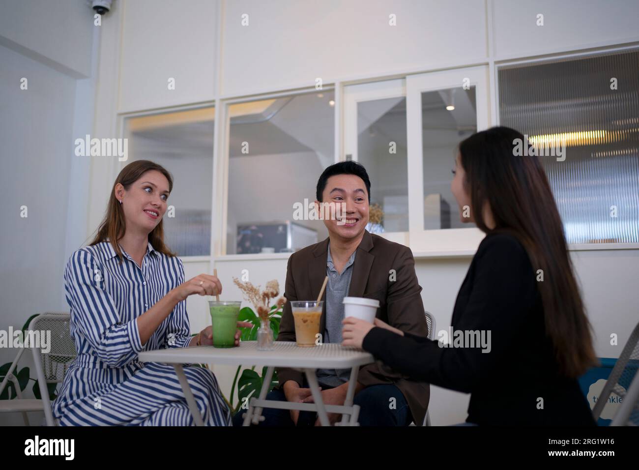 Coworkers hang out at coffee café. Coworker and friendship concept ...