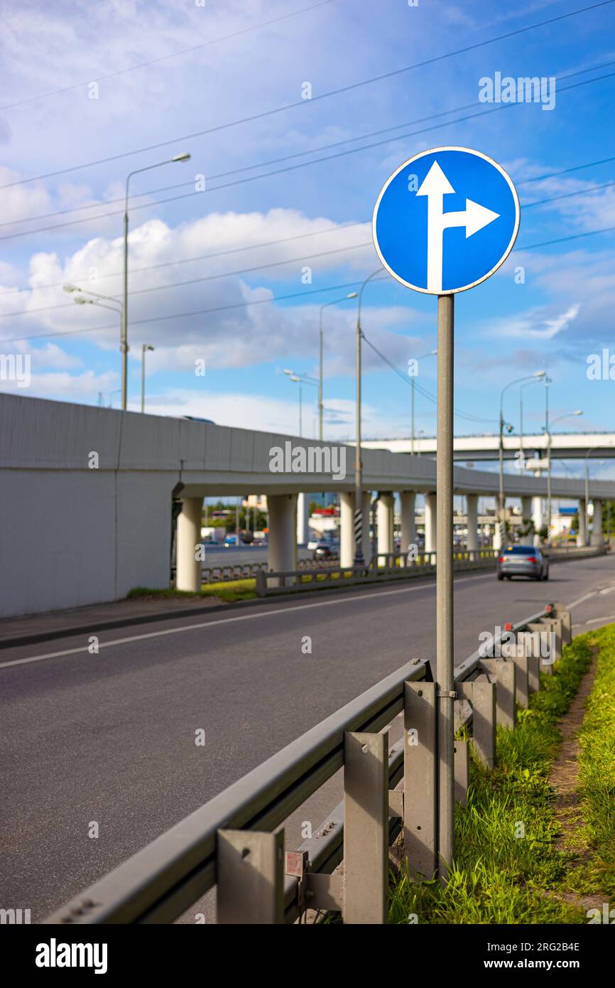 road sign indicating the direction of travel. road sign with an arrow ...