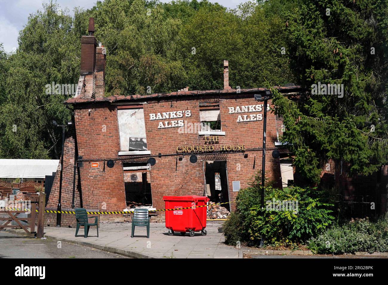 The burnt out remains of The Crooked House pub near Dudley. A fire ...