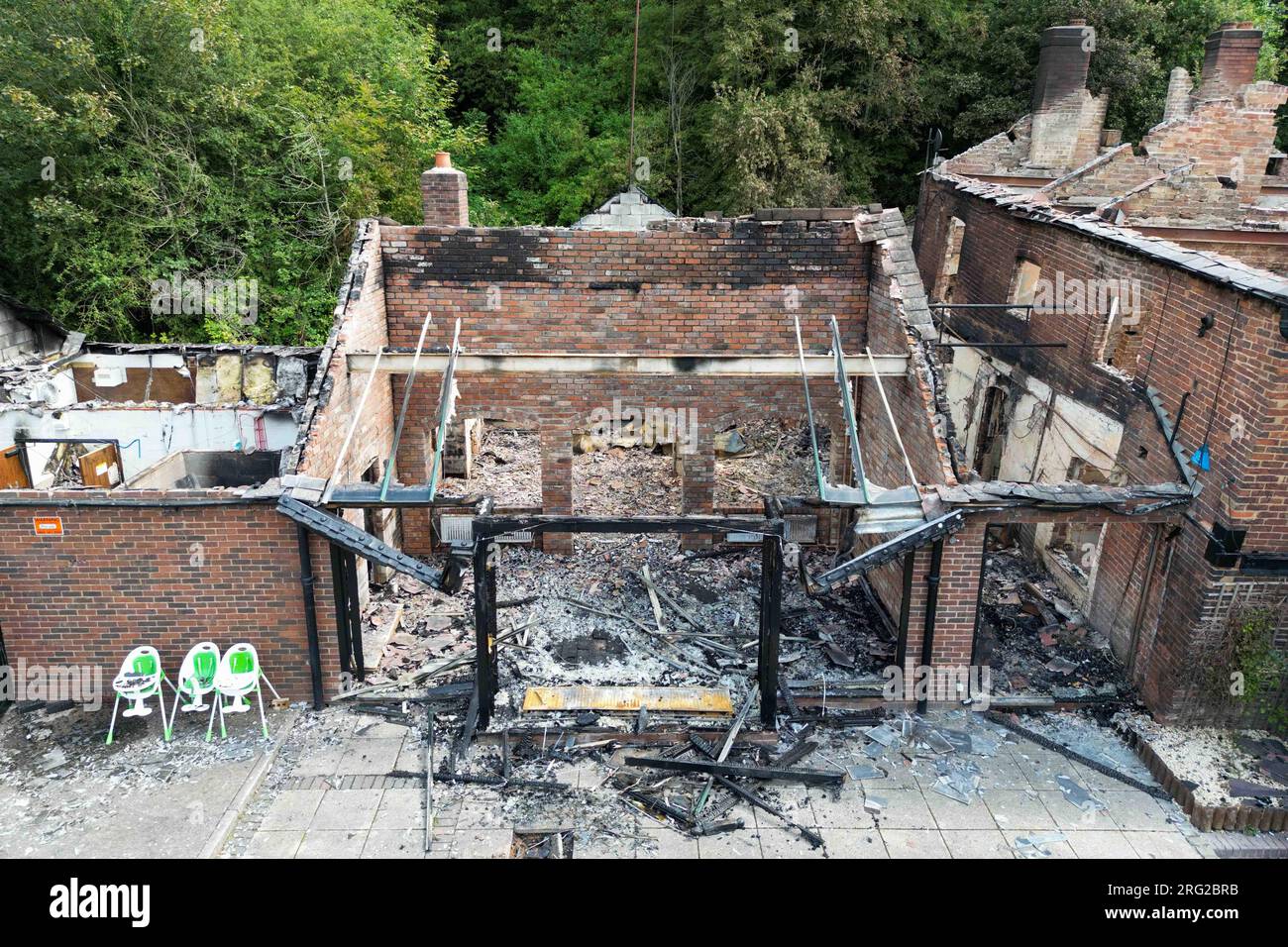 The burnt out remains of The Crooked House pub near Dudley. A fire ...