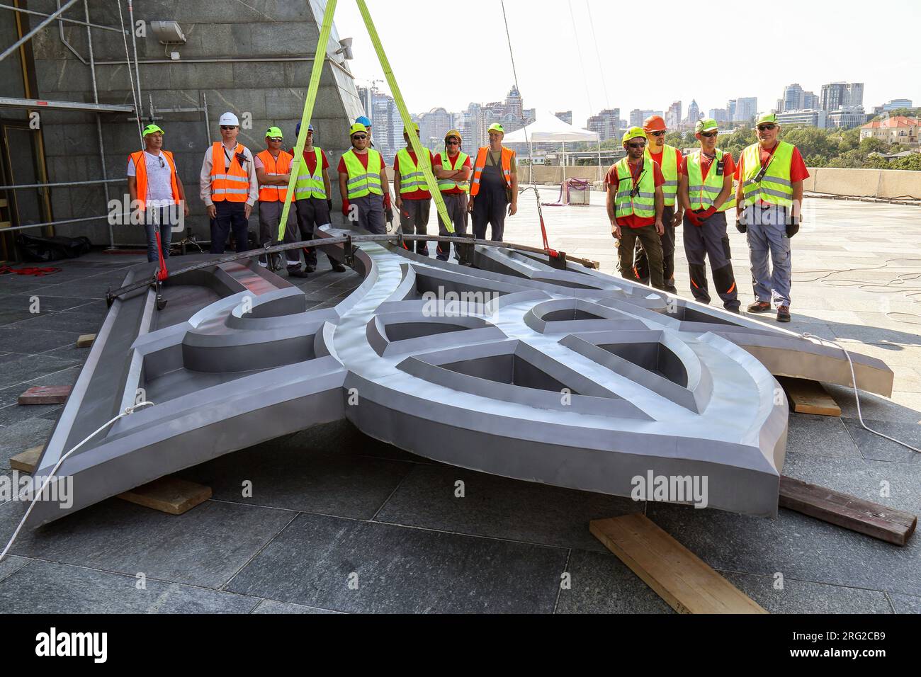 KYIV, UKRAINE - AUGUST 5, 2023 - Workers stand behind the Ukrainian ...