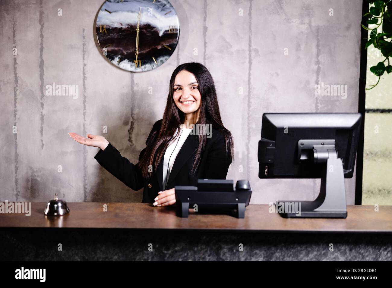 Portrait of receptionist at desk in lobby. Banner design. Friendly ...