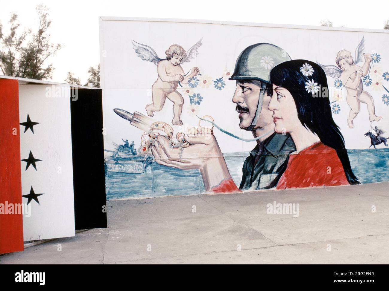 Basra, Iraq 1984. Mural depicting the Iraqi flag with depiction of ...