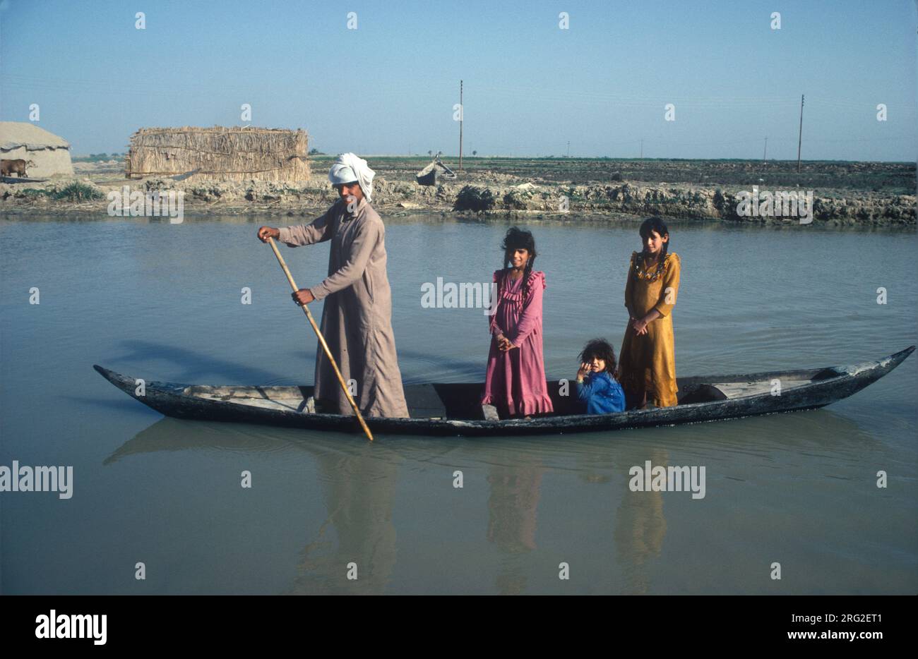 Marsh Arabs Iraq 1984. Fathers and children, three daughters in canoe ...