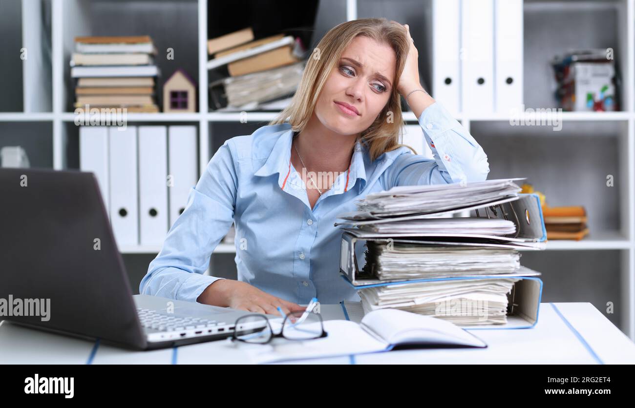 Lot of work wait for tired and exhausted woman Stock Photo - Alamy