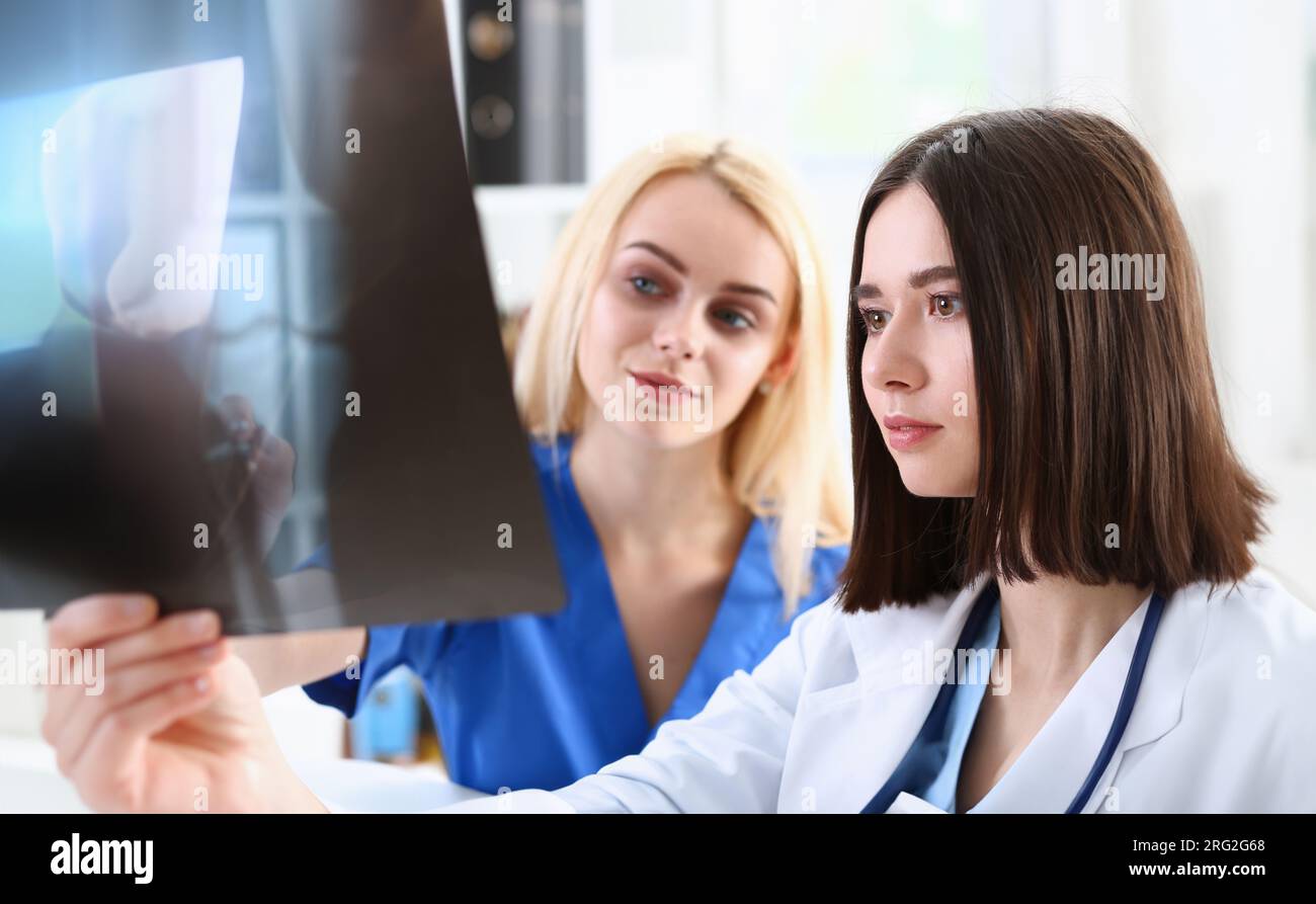 Group of beautiful female doctors hold Stock Photo - Alamy