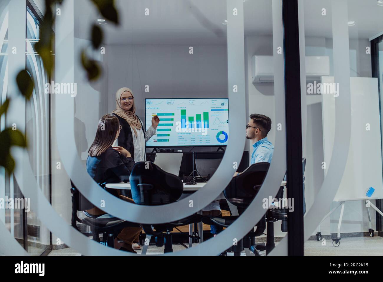 A diverse group of businessmen collaborates and tests a new virtual ...