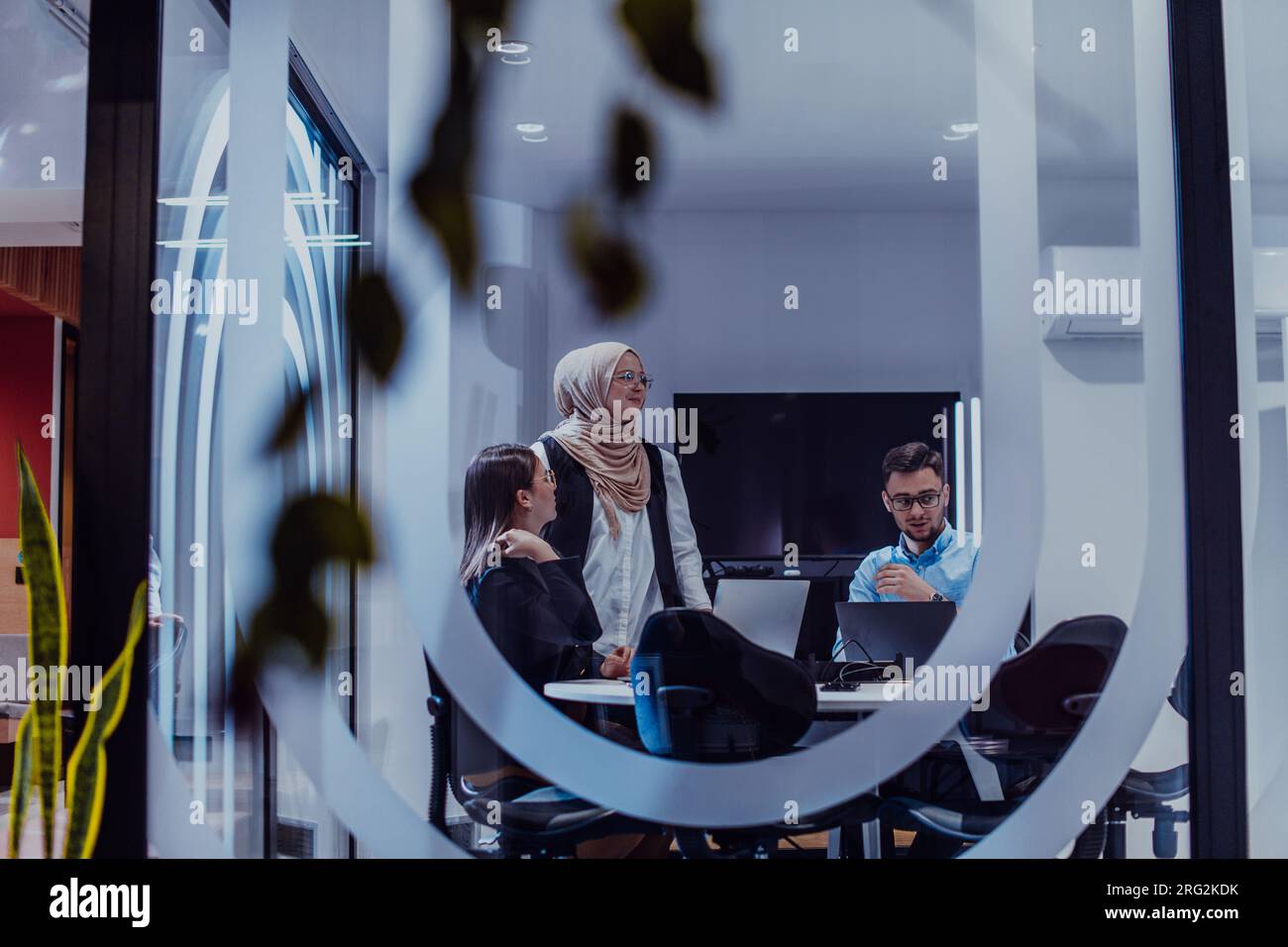 A diverse group of businessmen collaborates and tests a new virtual ...