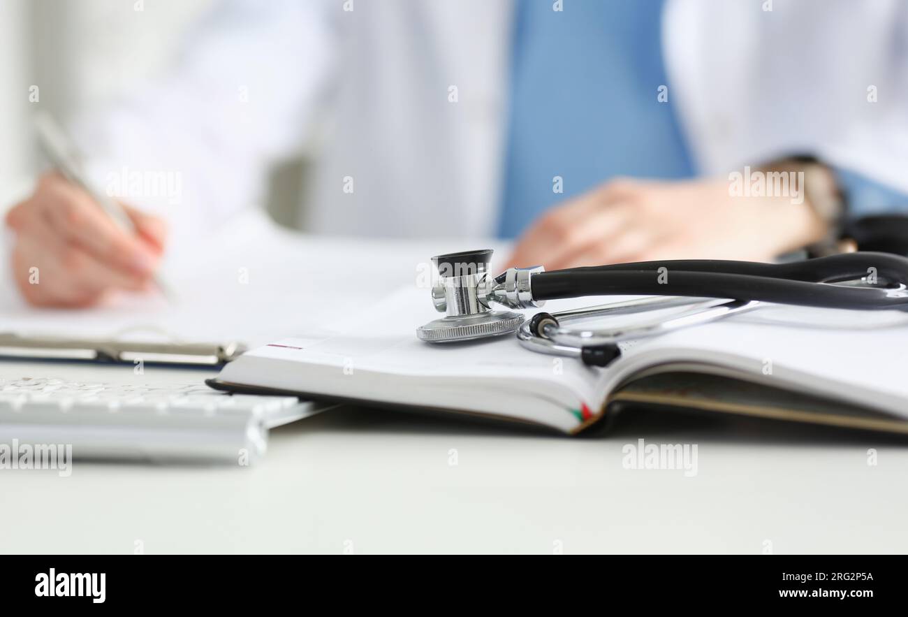 Stethoscope head lying on medical forms Stock Photo - Alamy