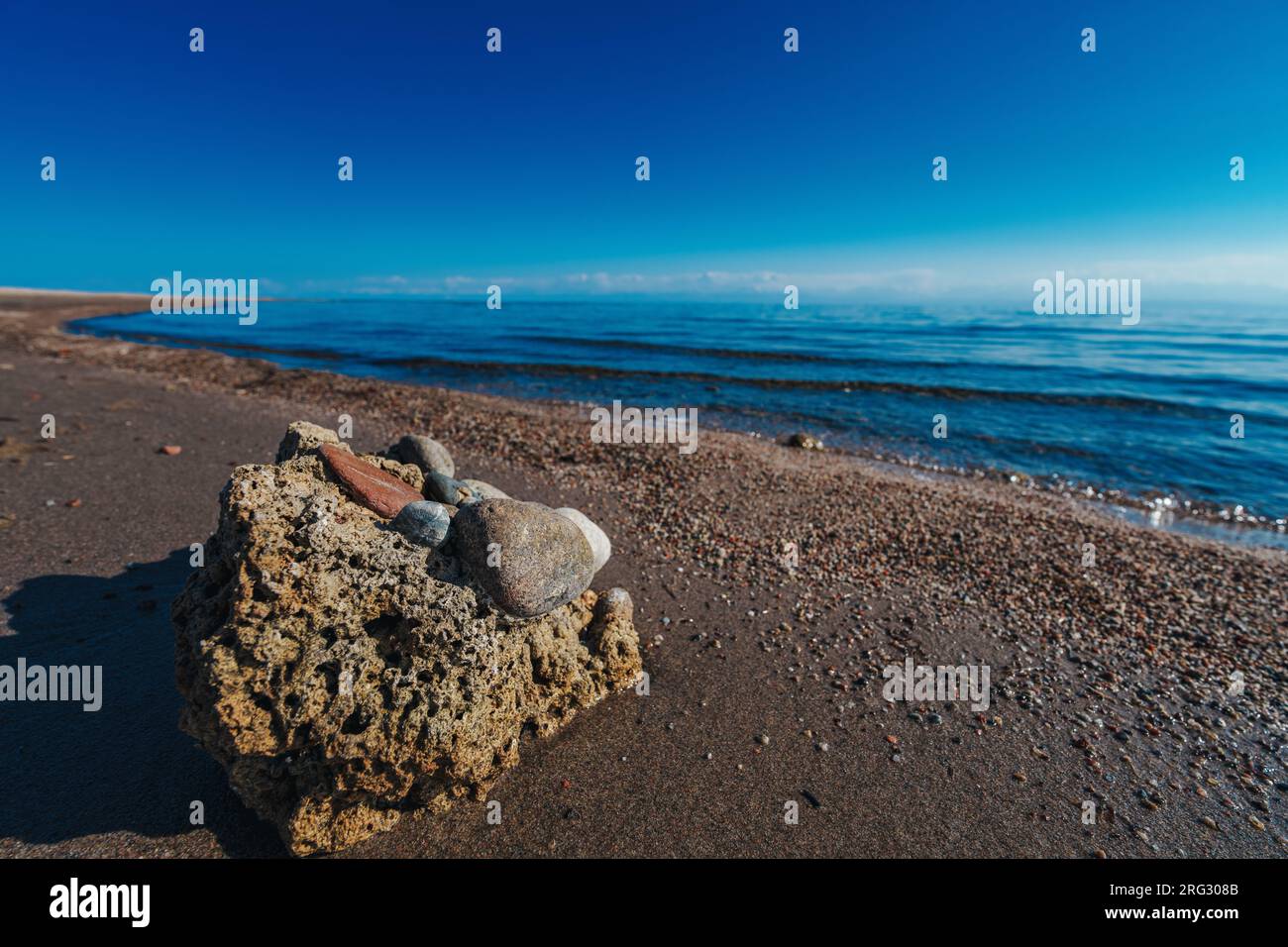 Rock on the lake shore, Issyk-Kul, Kyrgyzstan Stock Photo - Alamy