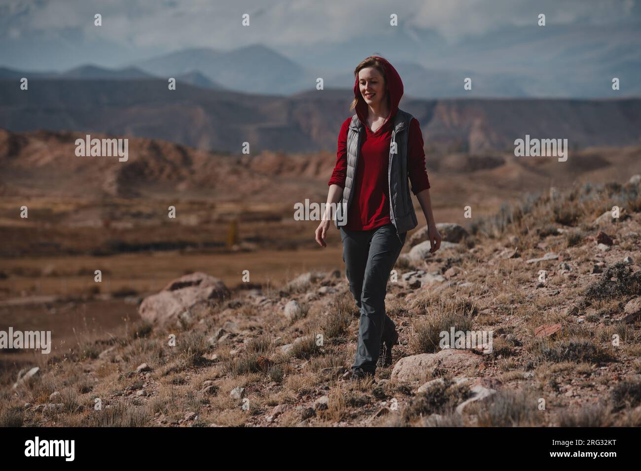 Young woman in red vest hi-res stock photography and images - Alamy