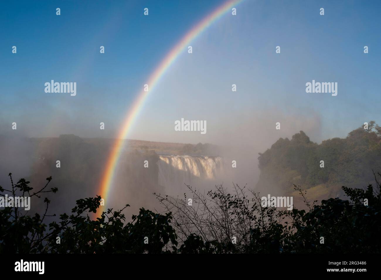 A double rainbow over misty Victoria Falls. Victoria Falls National ...
