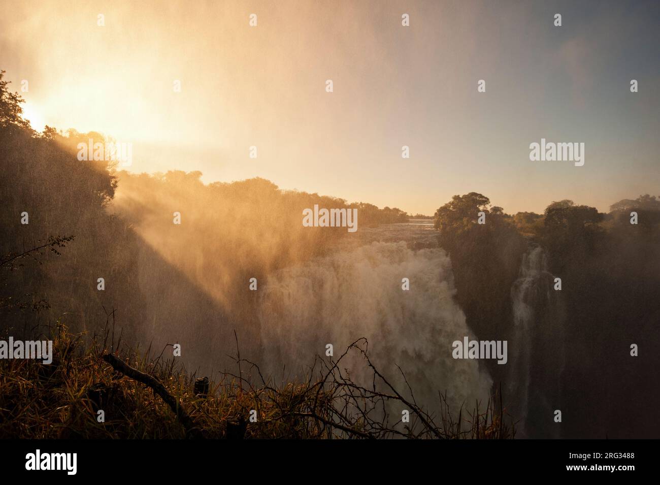 Sunlight through rising mist at Victoria Falls. Victoria Falls National ...